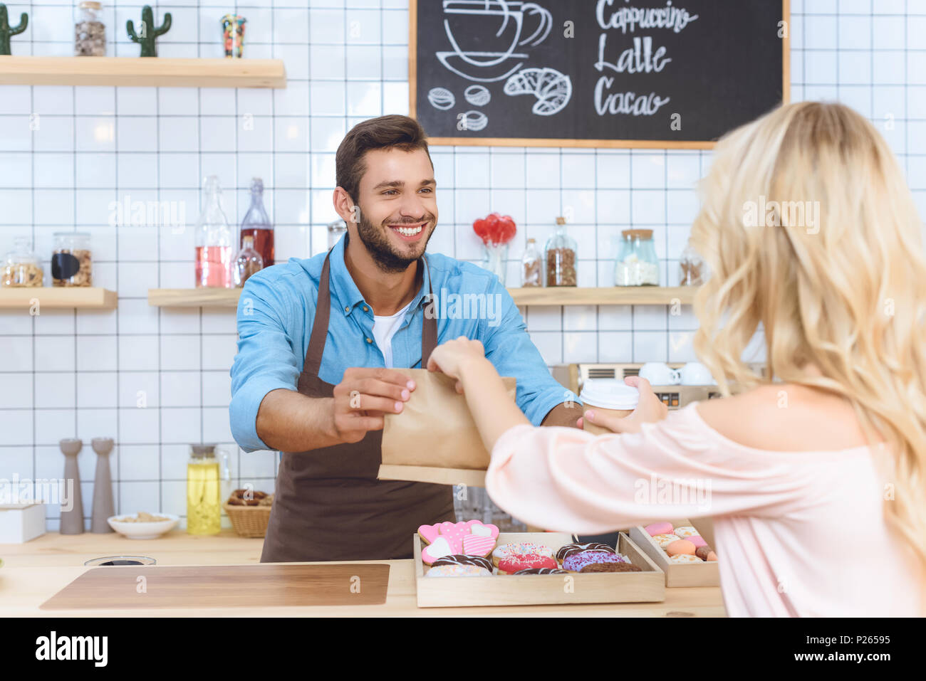 Waiter giving food hi-res stock photography and images - Alamy