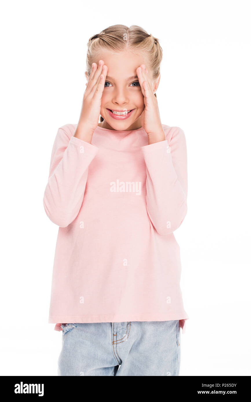 Happy shocked child in pink shirt covering face with hands, isolated on ...