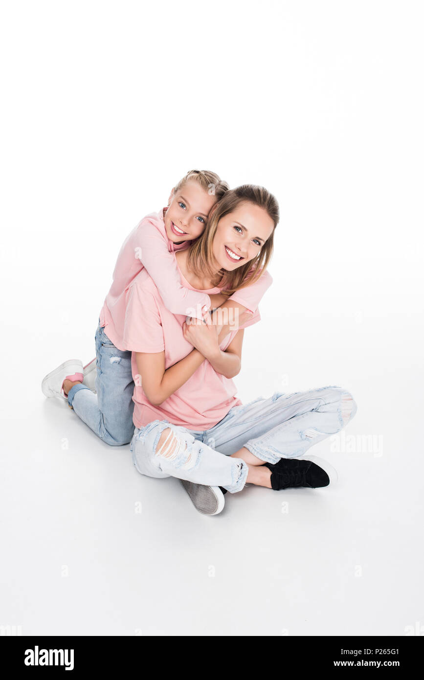 cheerful daughter and mother embracing together, isolated on white Stock Photo - Alamy
