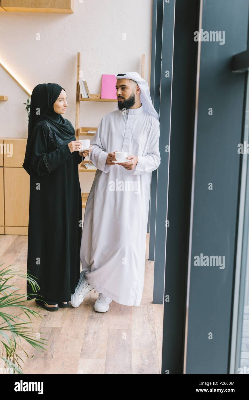 muslim couple drinking coffee together in modern cafe Stock Photo - Alamy