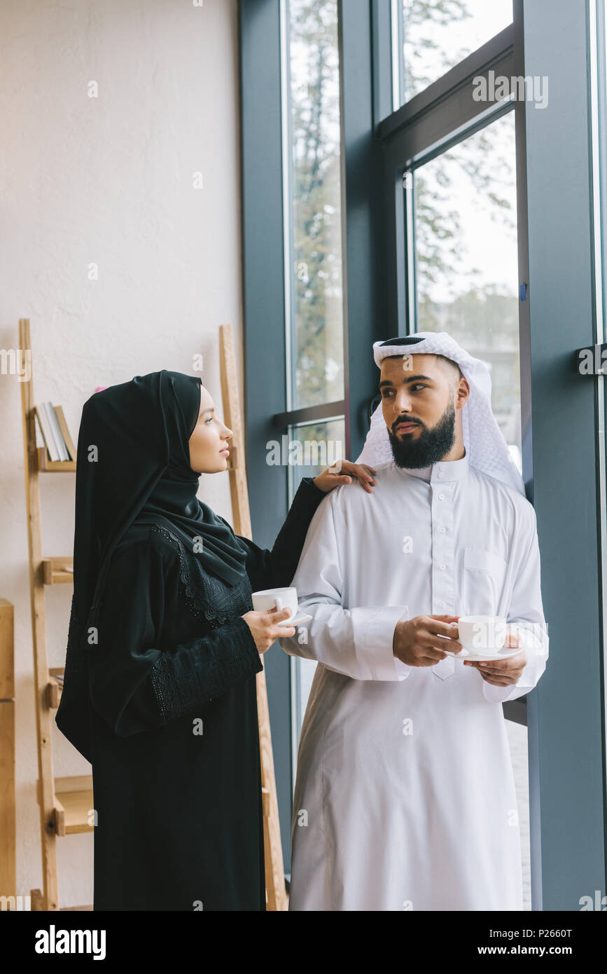 young muslim couple drinking coffee in modern cafe Stock Photo - Alamy