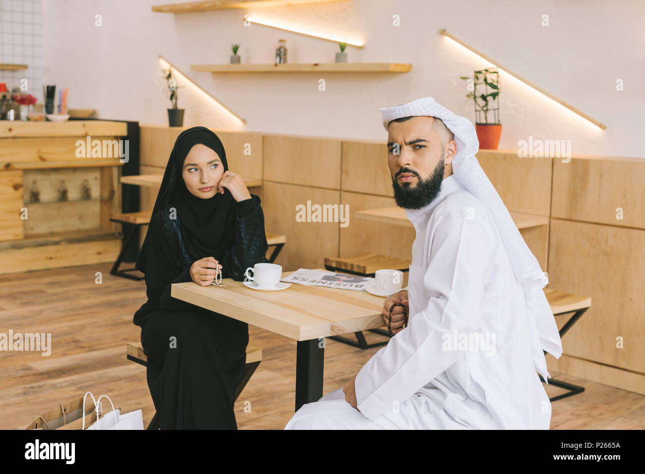 Arab woman drinking coffee in hi-res stock photography and images - Alamy