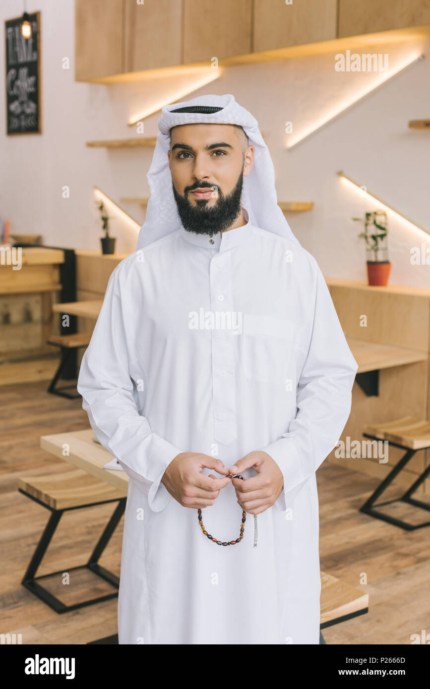 muslim man with prayer beads in modern cafe Stock Photo - Alamy