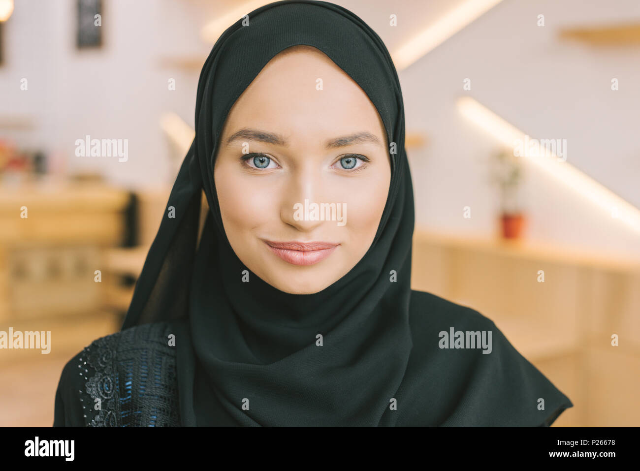 young beautiful muslim woman in hijab looking at camera Stock Photo - Alamy
