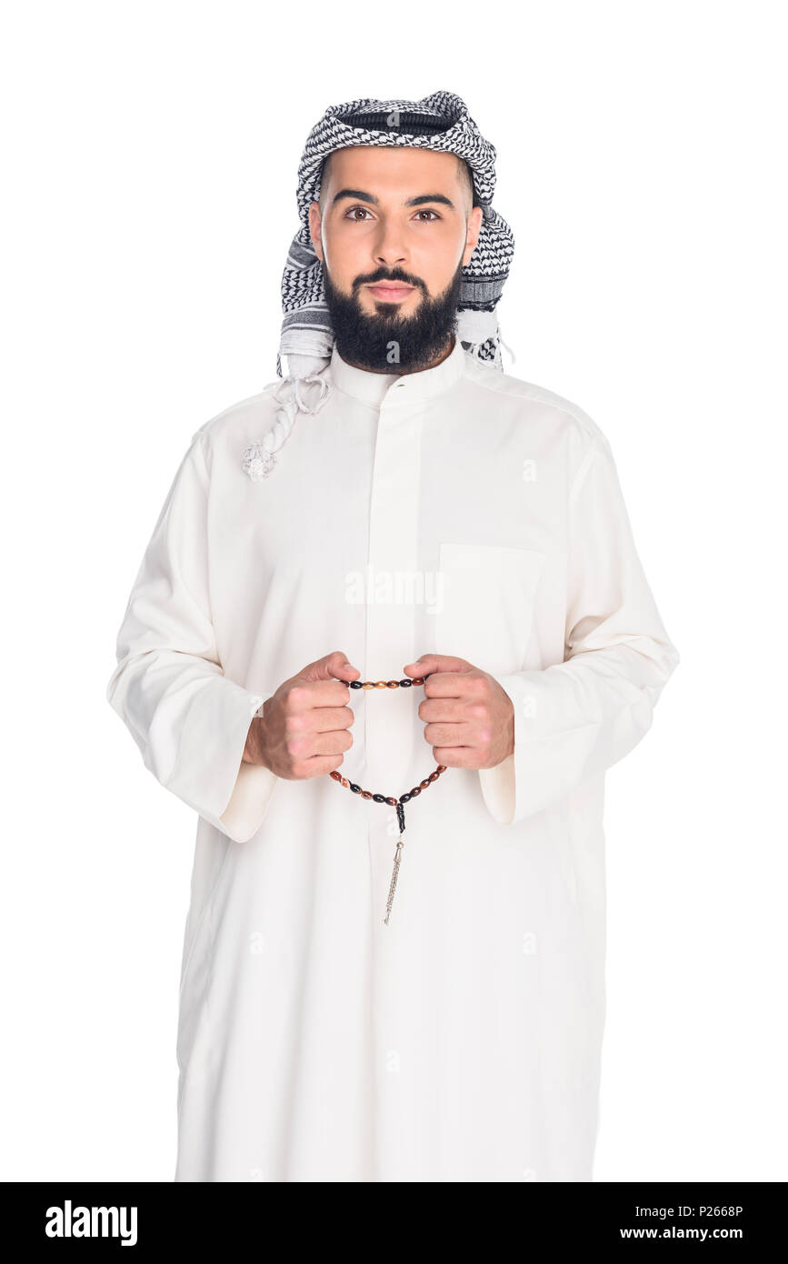 handsome young muslim man with prayer beads isolated on white Stock ...
