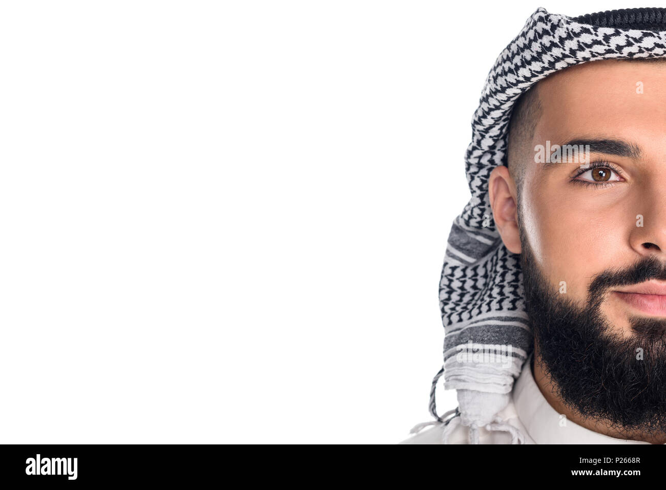 close-up portrait of half face of muslim man isolated on white with ...