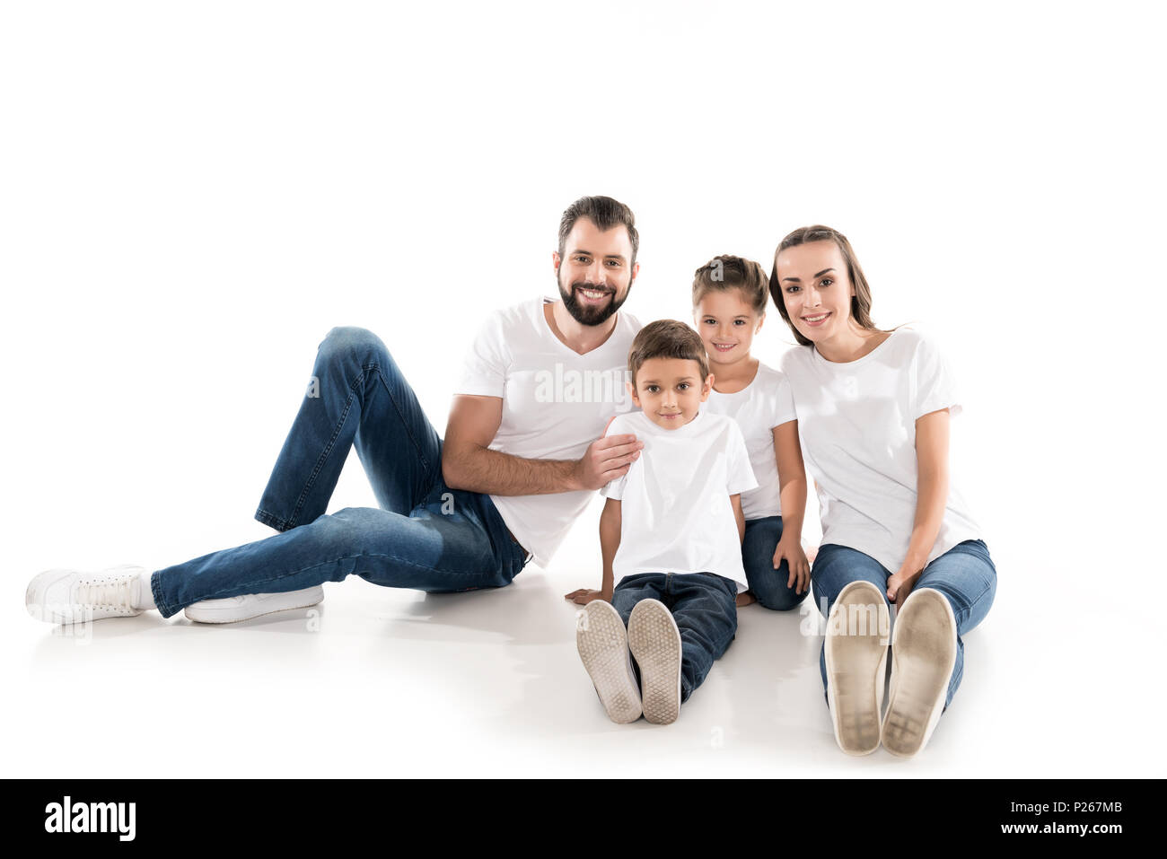 happy parents and kids looking at camera isolated on white Stock Photo ...