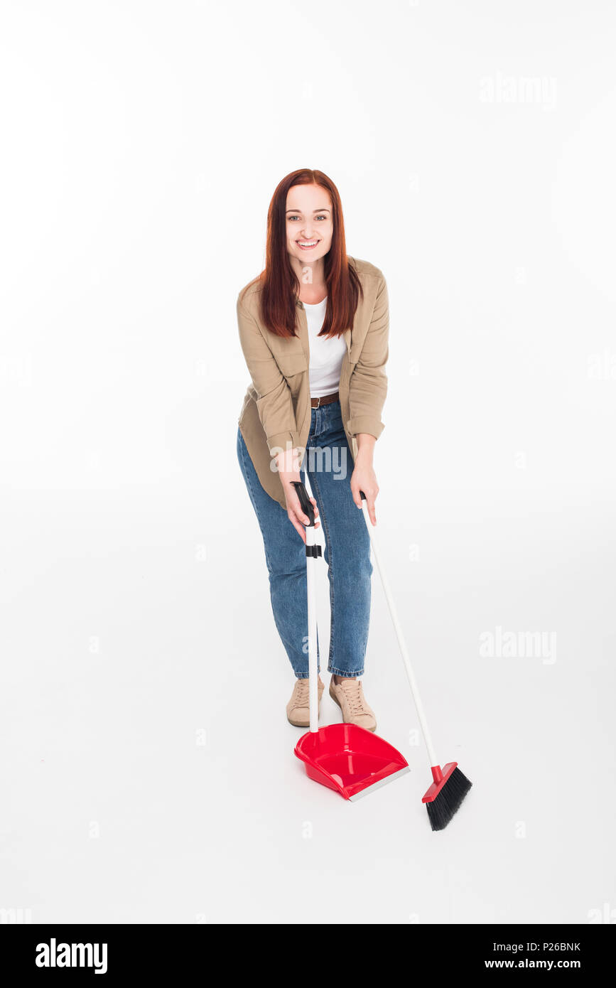 attractive woman sweeping with broom, isolated on white Stock Photo - Alamy