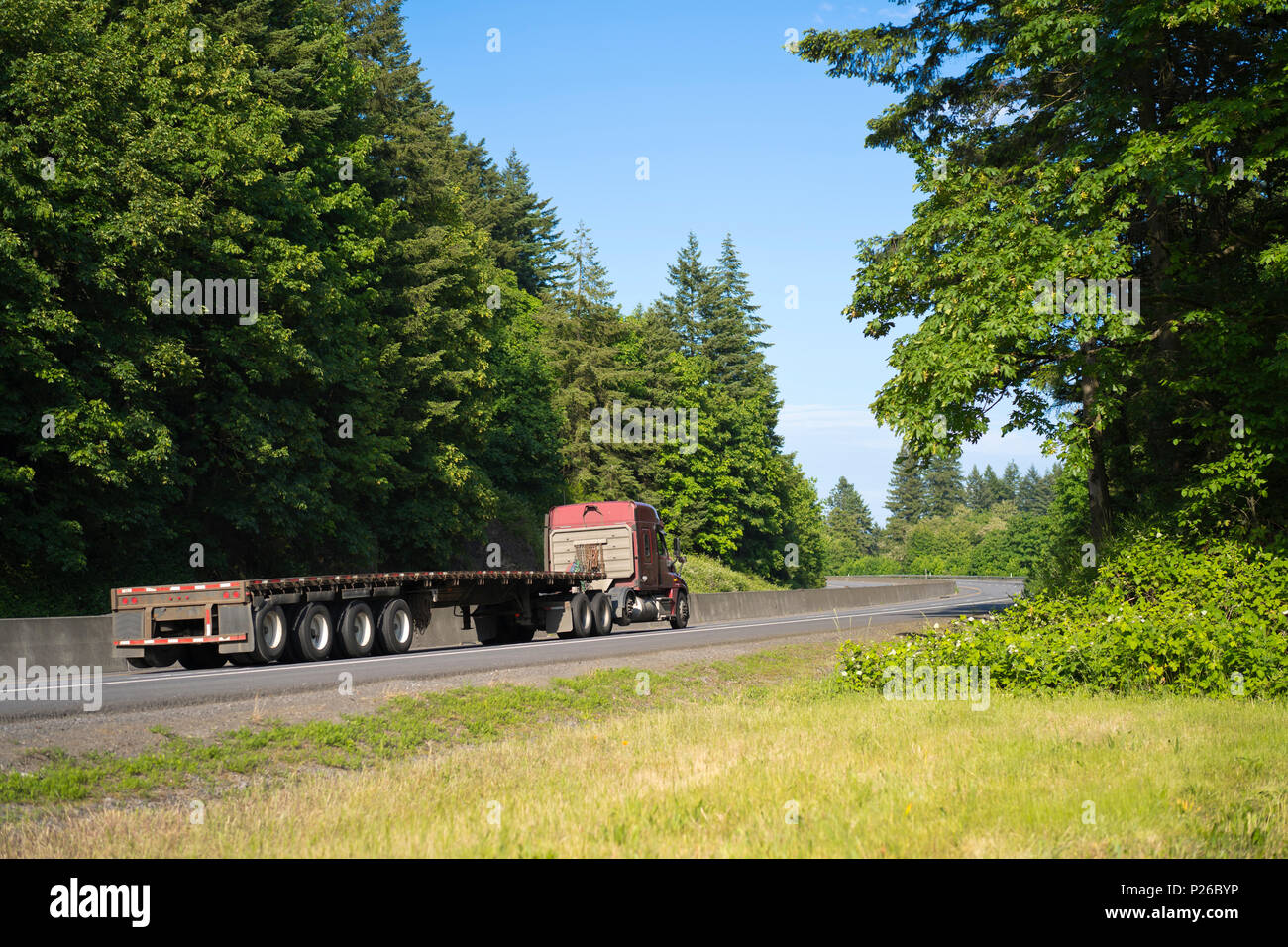 Commercial low profile cab big rig red long haul semi truck ...