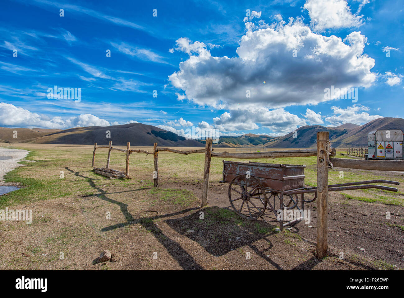 Italy, Umbria, Sibillini Park, Barrow and fence Stock Photo - Alamy
