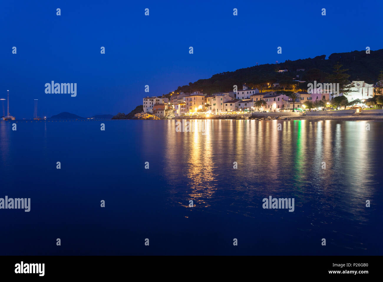The old village of Marciana Marina at dusk, Elba Island, Livorno ...