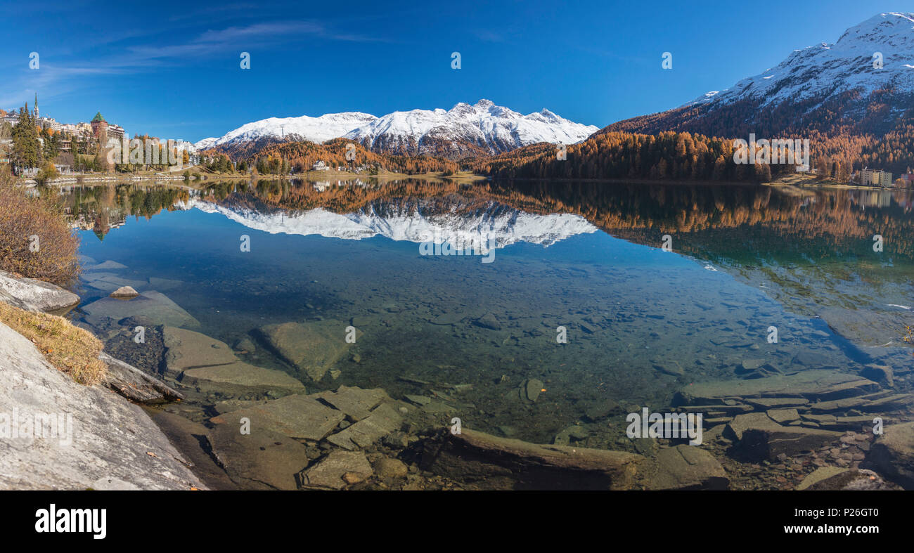 Snowy peaks reflected in lake during autumn, St Moritz, canton of ...