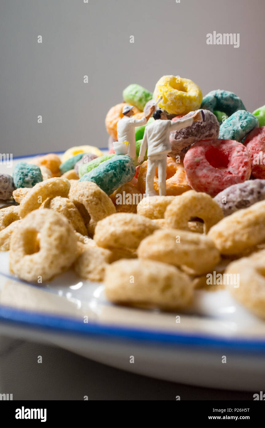 Tiny painting crew paints the oat loop cereal rainbow of colors Stock ...