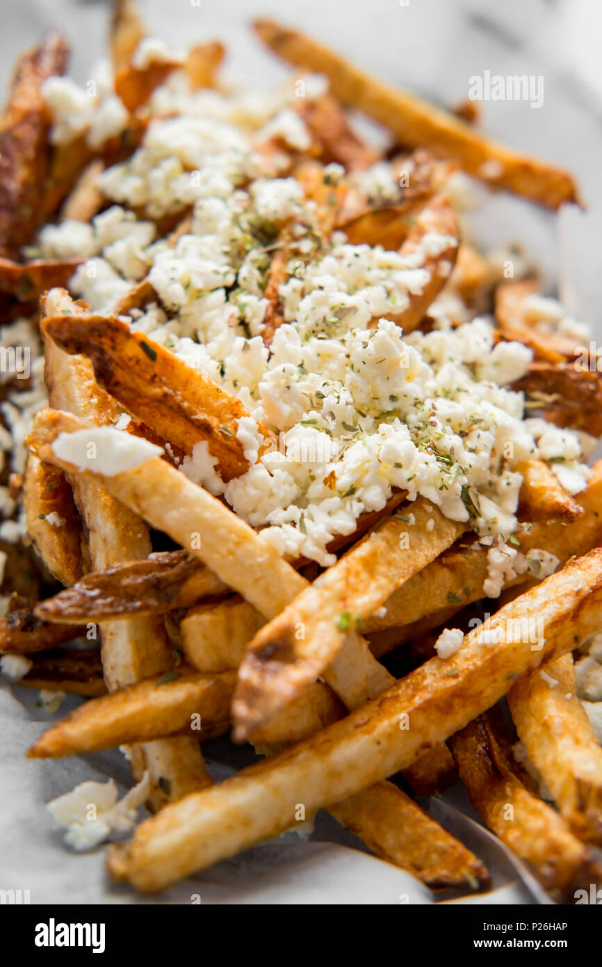 Delicious Mediterranean street cart fried potatoes with feta cheese ...