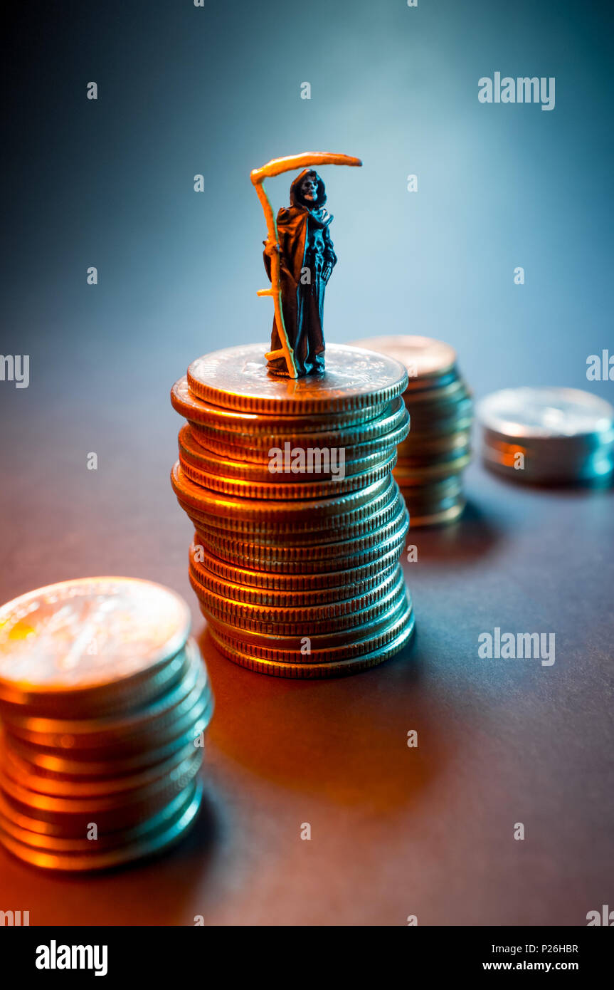 Grim reaper with pile of cash symbolizing the evil of money Stock Photo ...