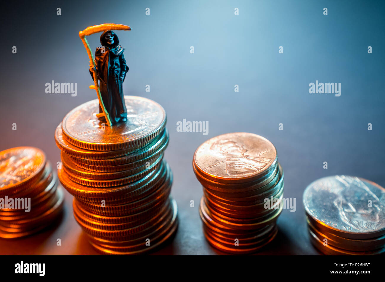Grim reaper with pile of cash symbolizing the evil of money Stock Photo ...