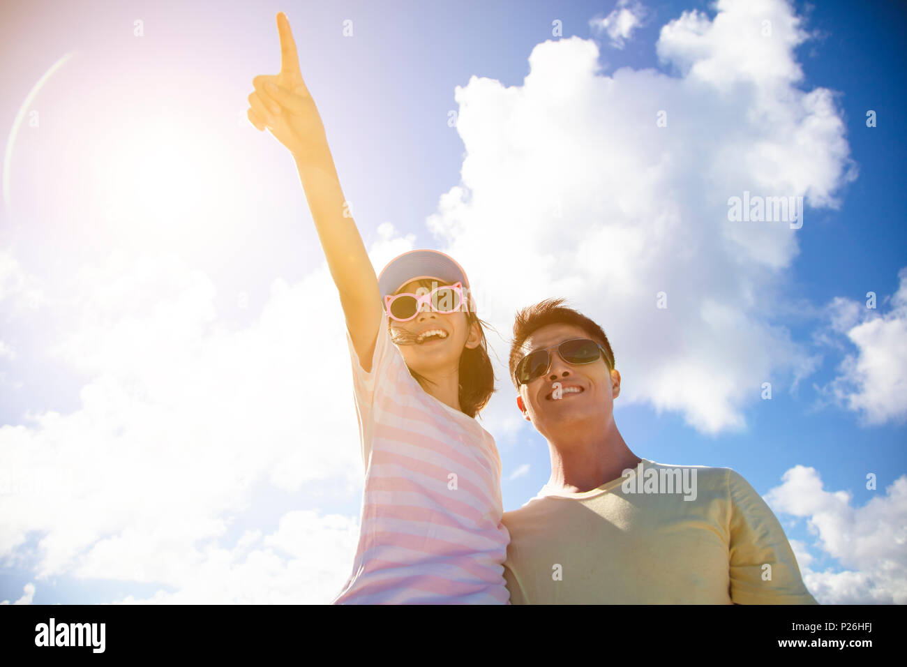 father and daughter looking away and pointing Stock Photo - Alamy