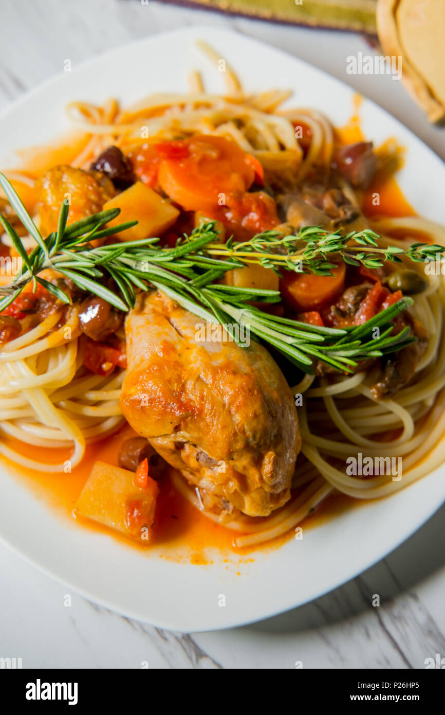 Italian chicken Cacciatore hunter's stew with spaghetti noodles and ...