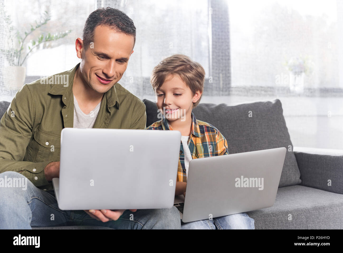 Using laptops hi-res stock photography and images - Alamy