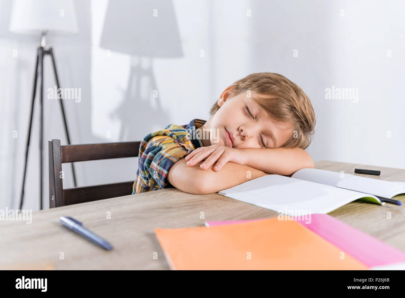 Boy sleeping on homework hi-res stock photography and images - Alamy
