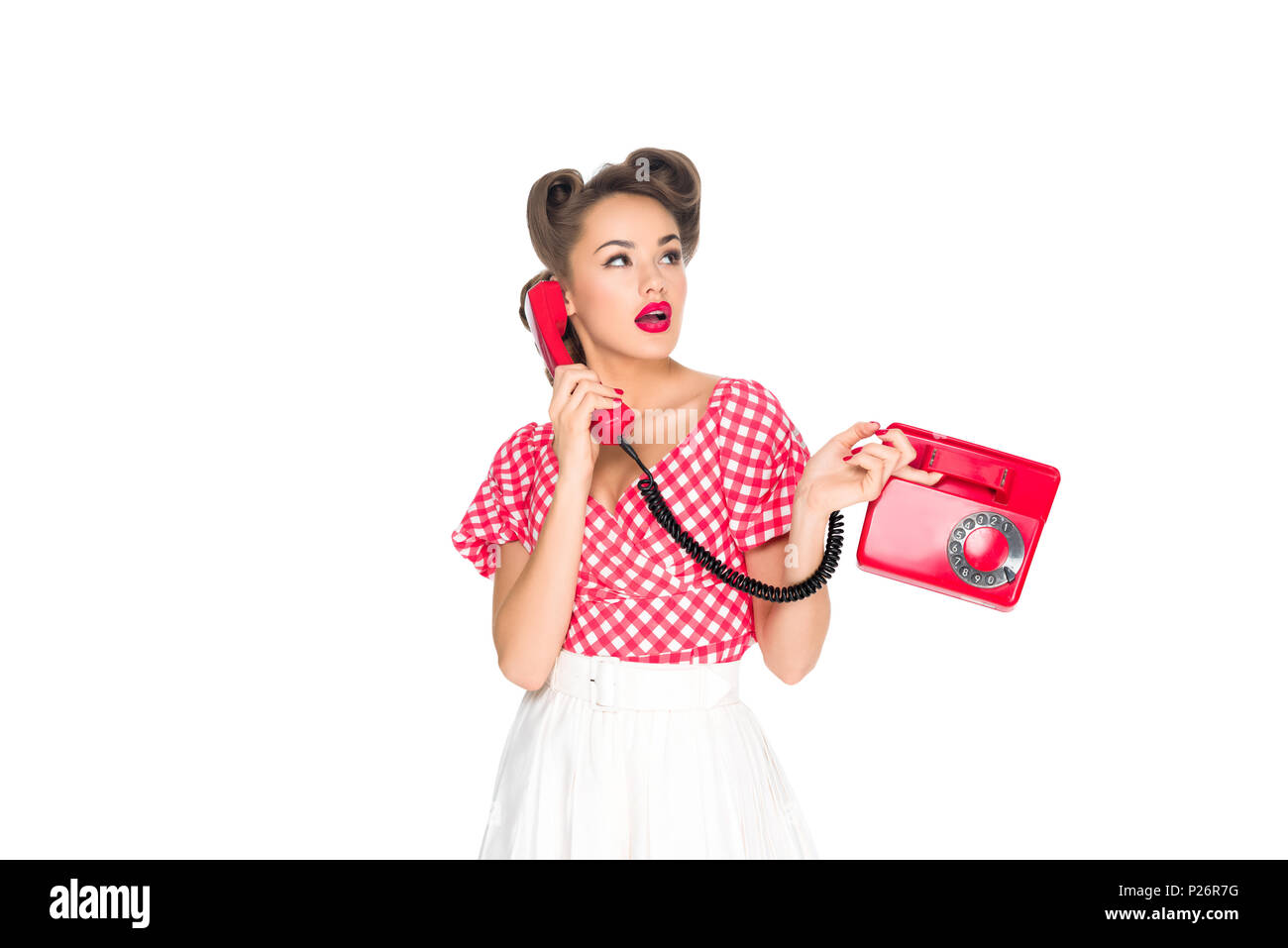portrait of pin up woman talking on old telephone isolated on white ...