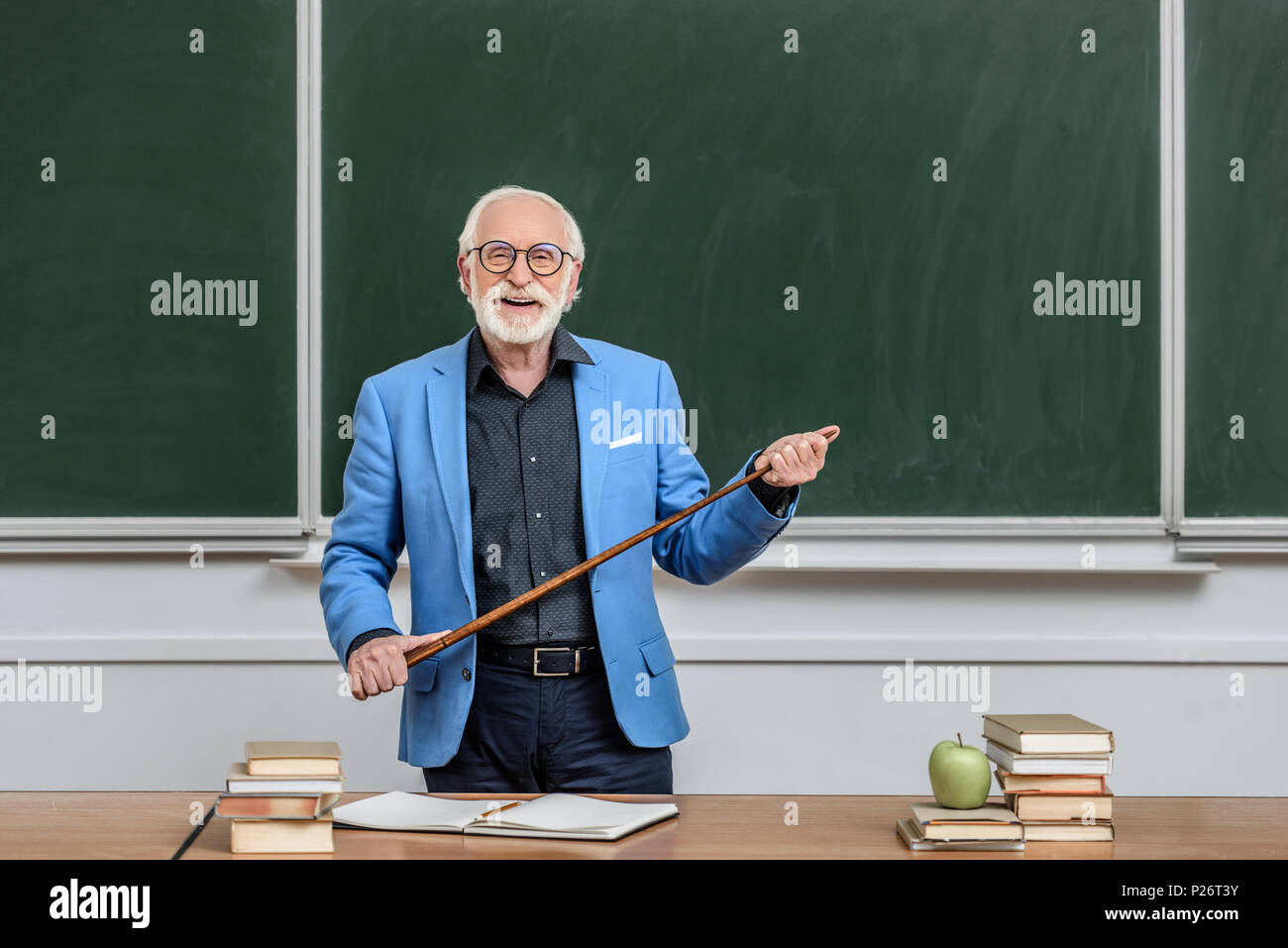 smiling grey hair professor holding wooden pointer Stock Photo - Alamy