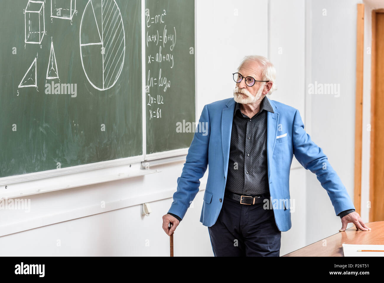 grey hair professor looking at blackboard Stock Photo - Alamy