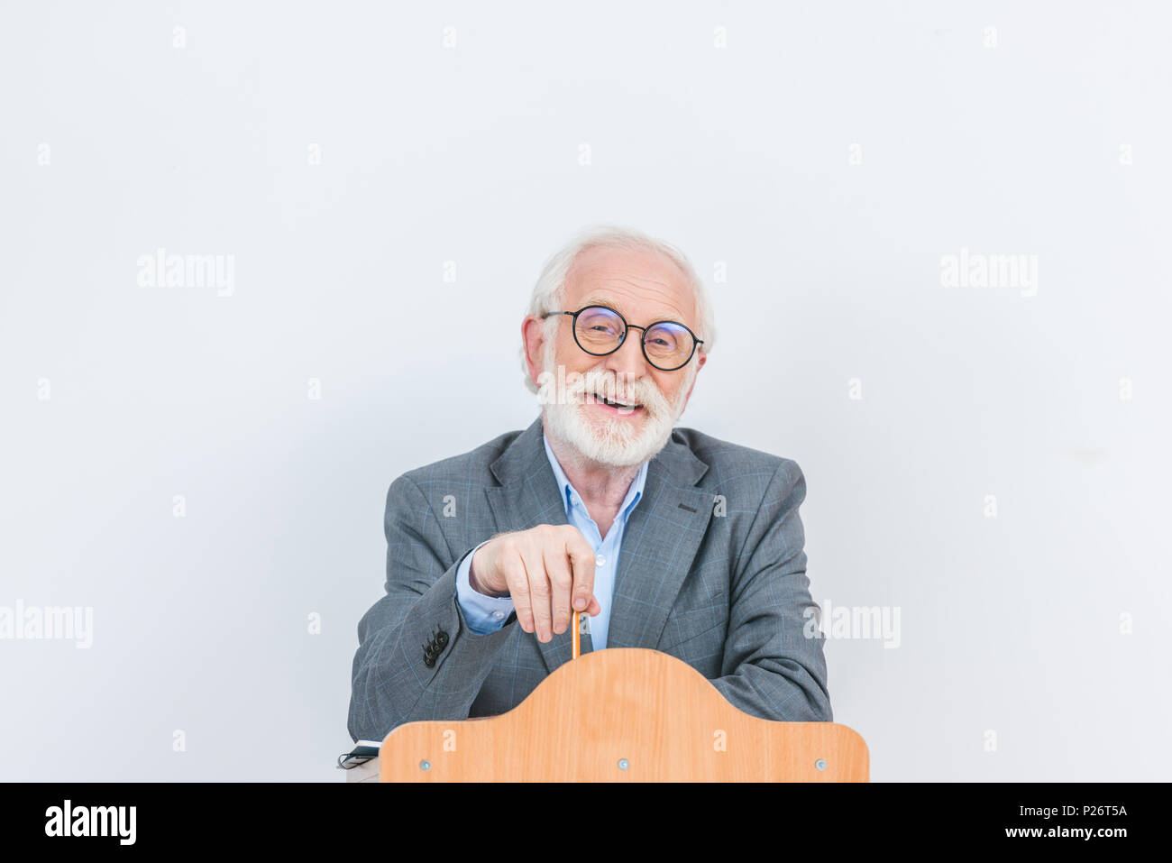 happy senior lecturer standing at wooden tribune isolated on white ...