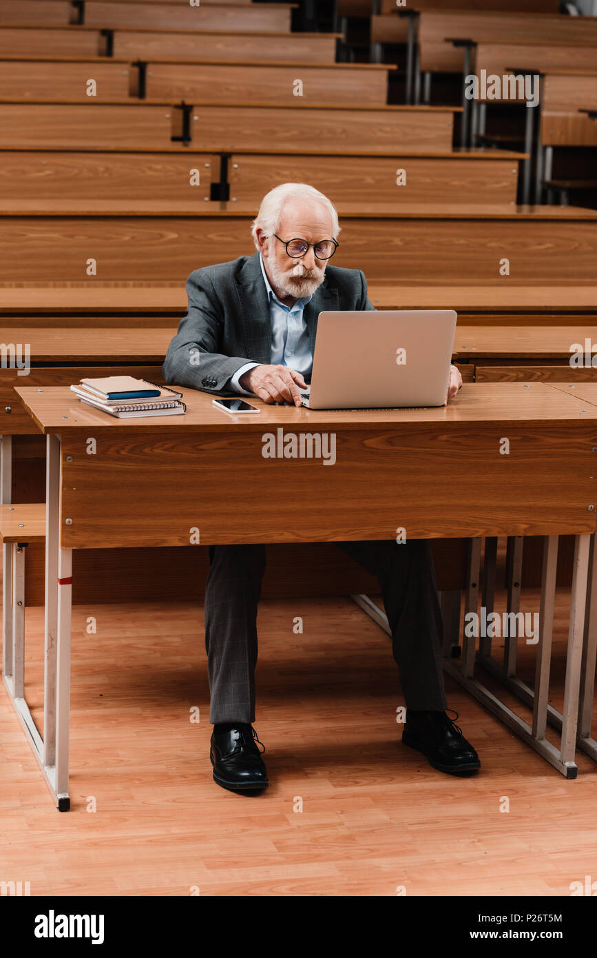 grey hair professor working with laptop Stock Photo - Alamy