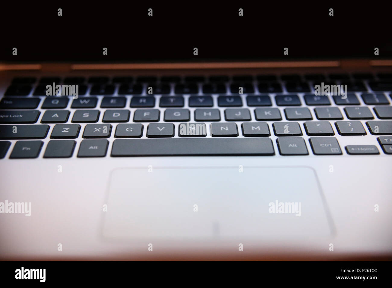 Blue light laptop keyboard Stock Photo - Alamy