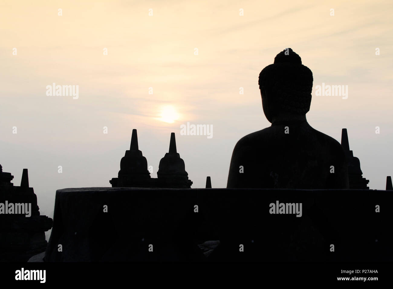 Silhouette Borobudur Temple with the Buddha statue at dawn, Yogyakarta ...