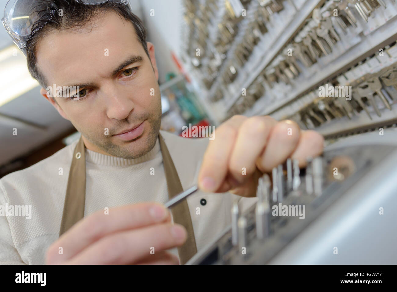 man cutting keys Stock Photo - Alamy