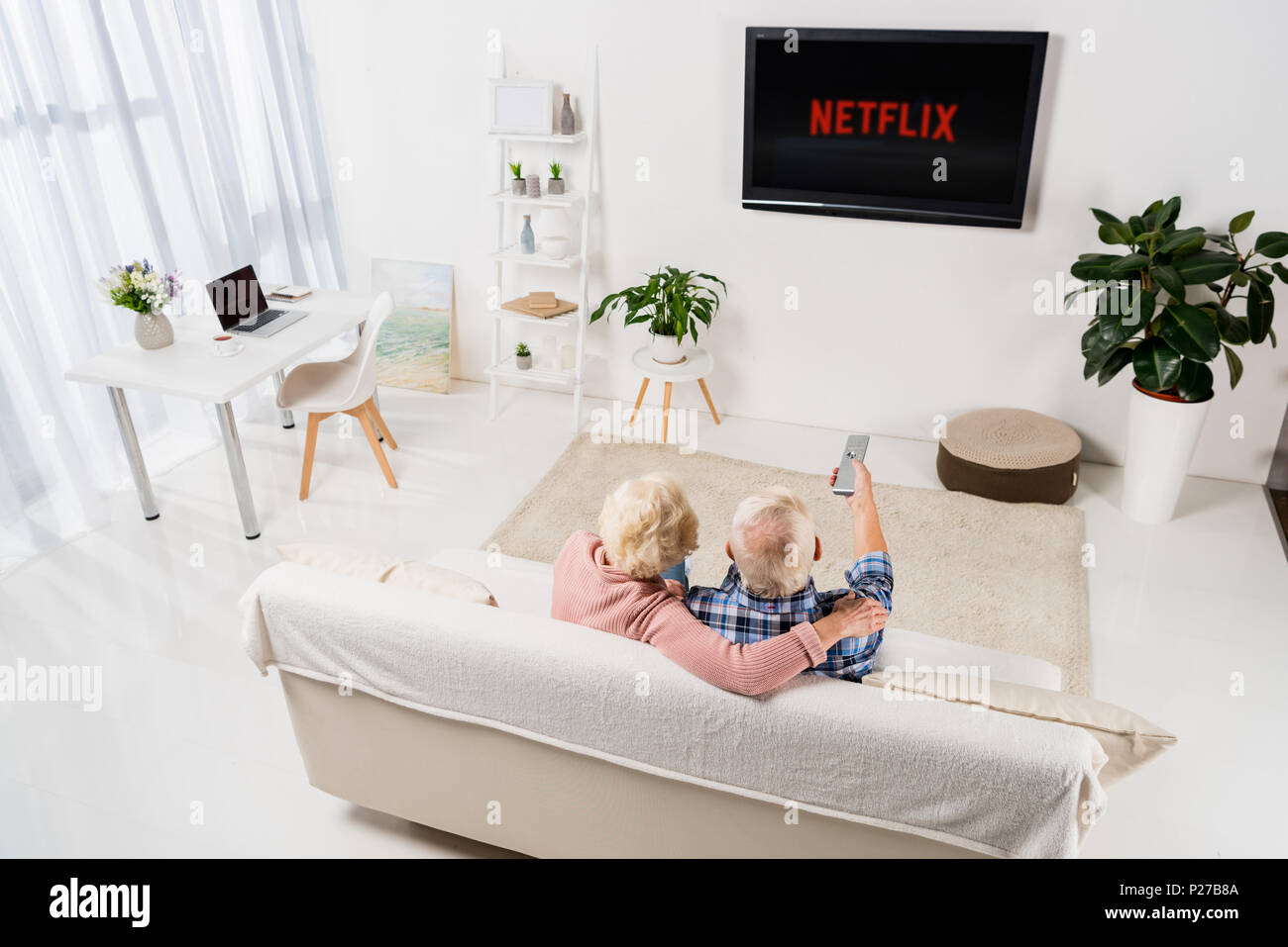 senior couple watching netflix on tv at home Stock Photo - Alamy