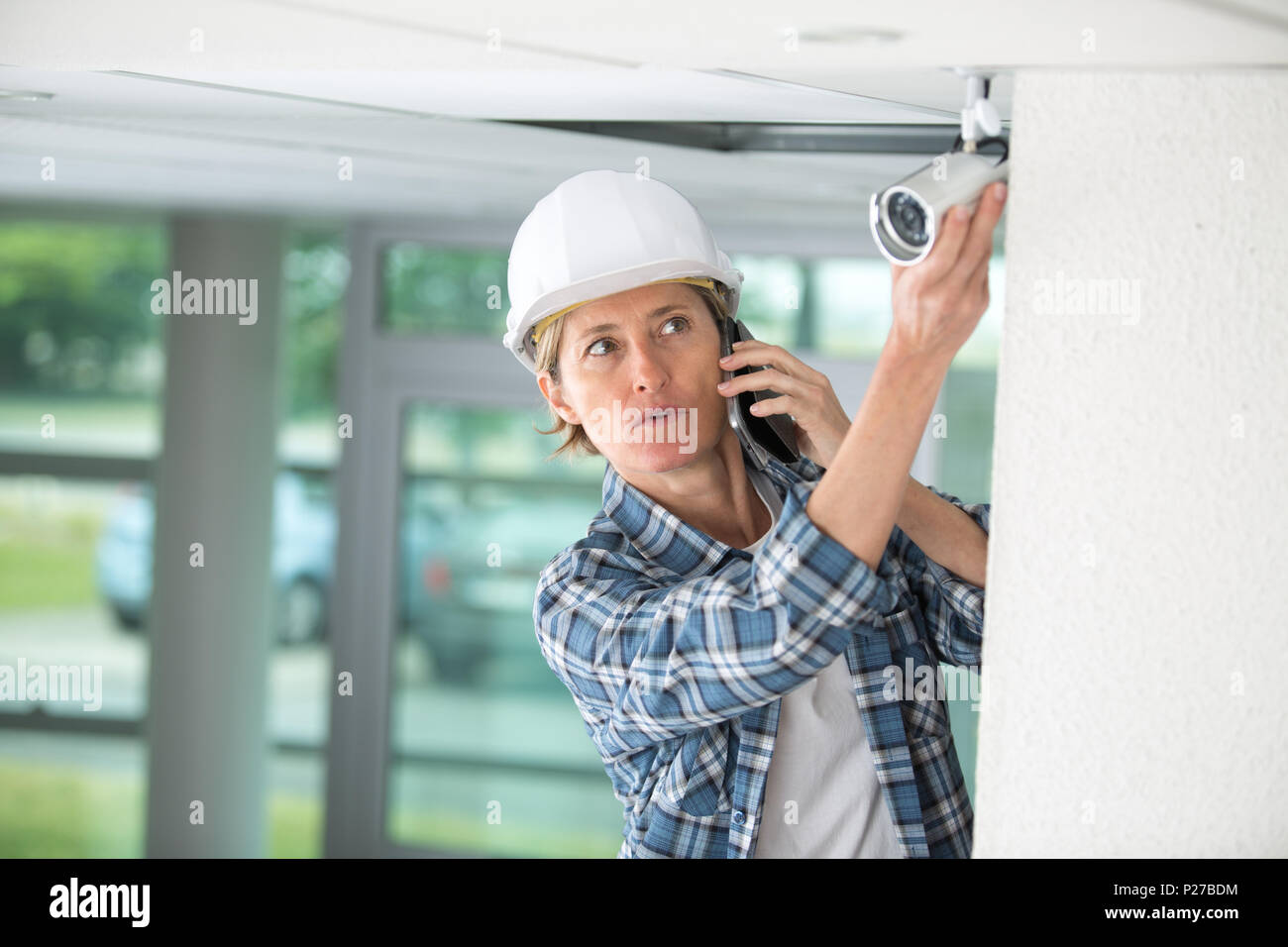 female professional cctv technician working Stock Photo - Alamy