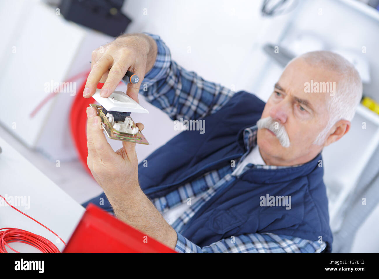 senior male tech tests electronic equipment Stock Photo - Alamy