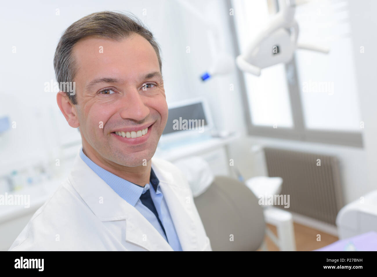a smiling dentist Stock Photo - Alamy