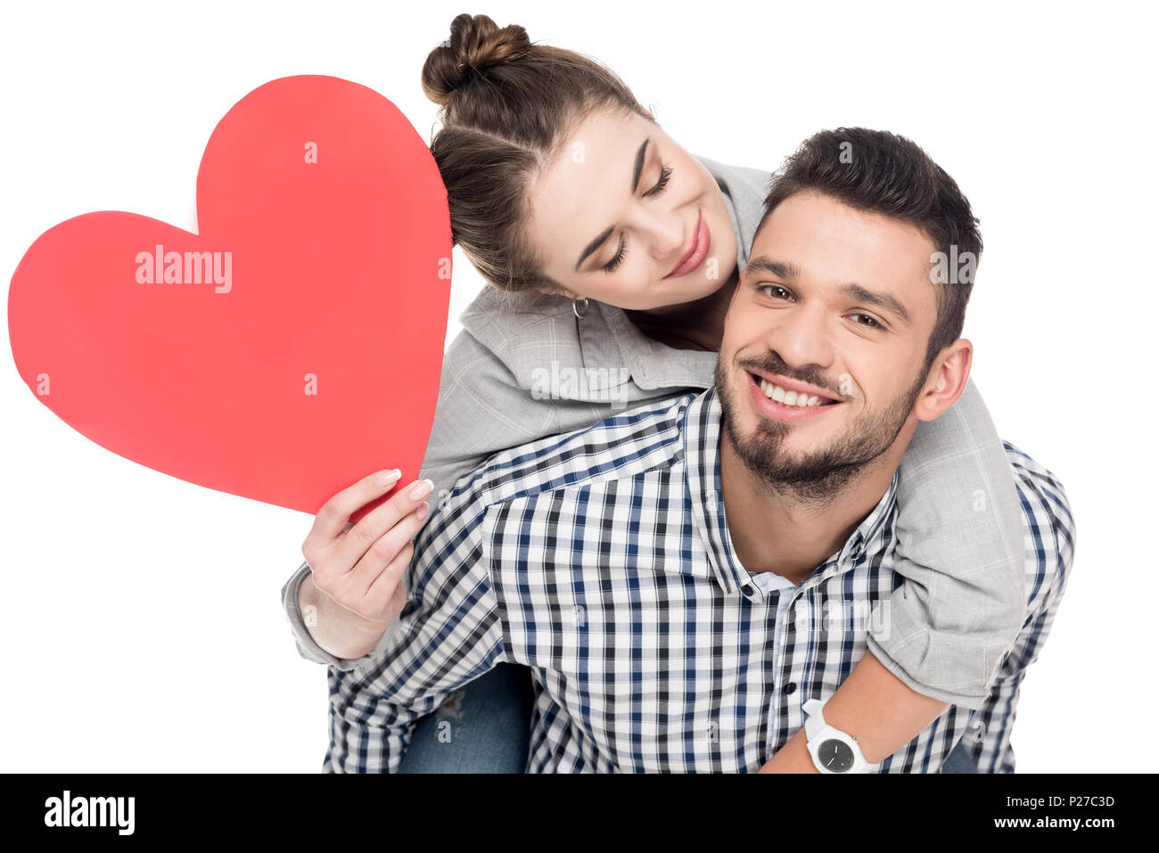 boyfriend giving piggyback to girlfriend holding red heart isolated on ...