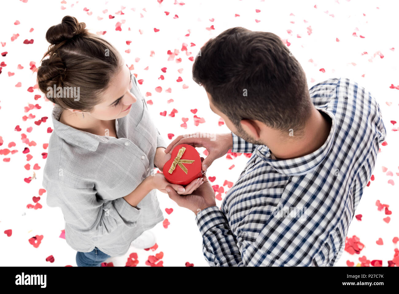 overhead view of girlfriend giving boyfriend present box isolated on ...