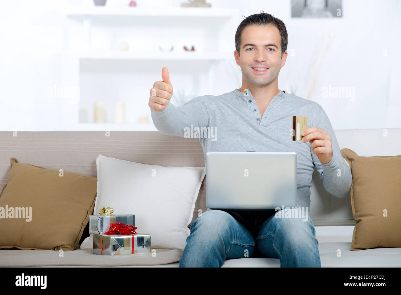 happy man in house buying online Stock Photo - Alamy