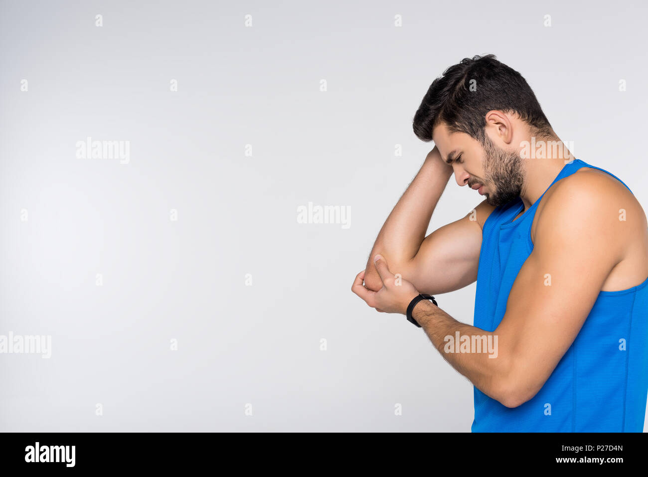 side view of young man with arm pain isolated on white Stock Photo - Alamy