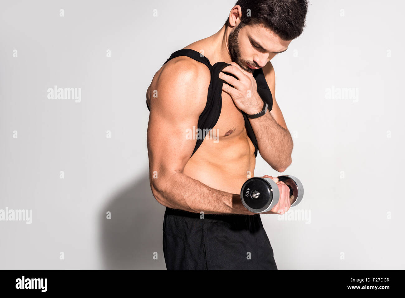 handsome young man working out with dumbbell Stock Photo - Alamy