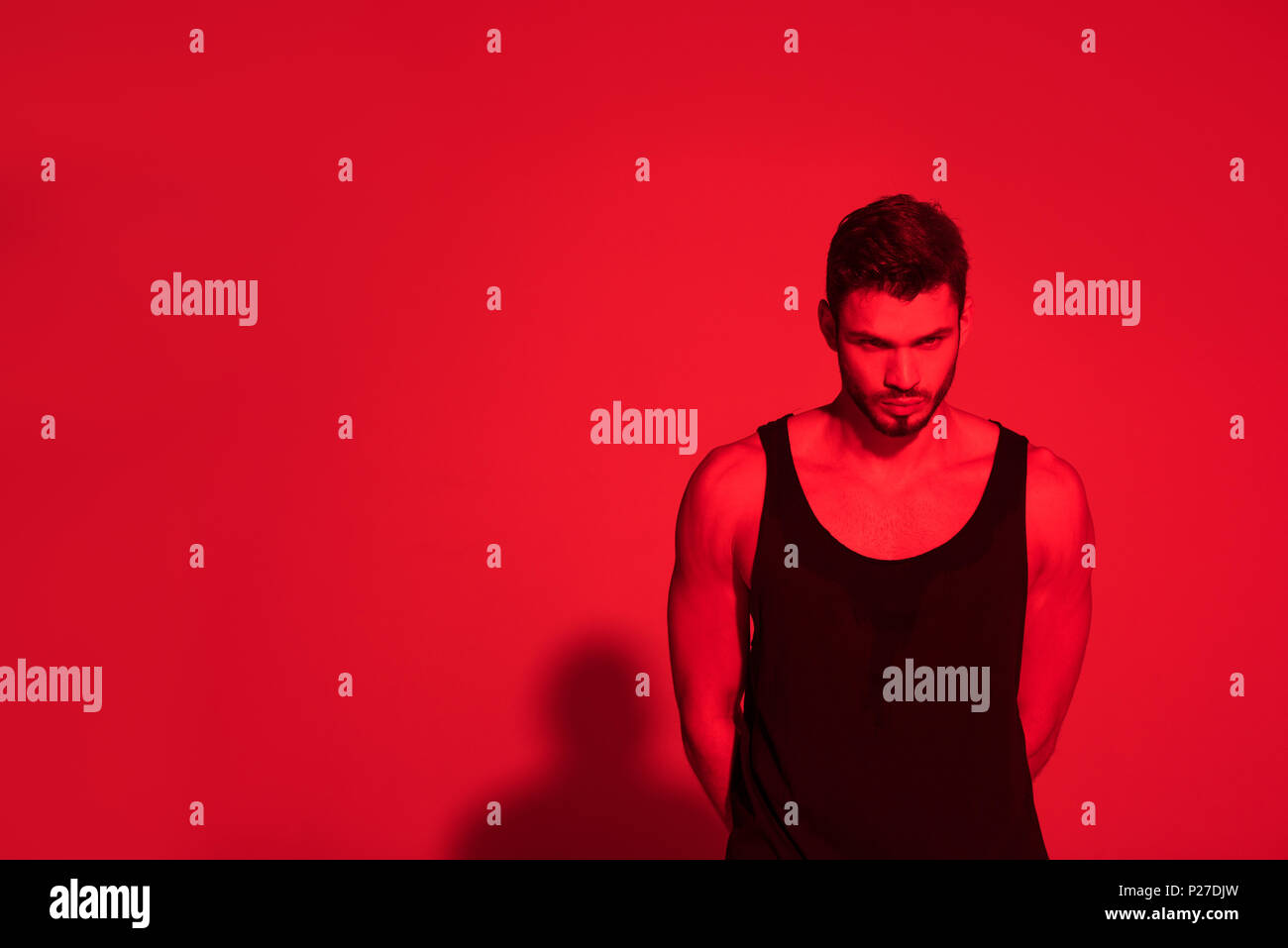 angry young man under contrast red light Stock Photo - Alamy