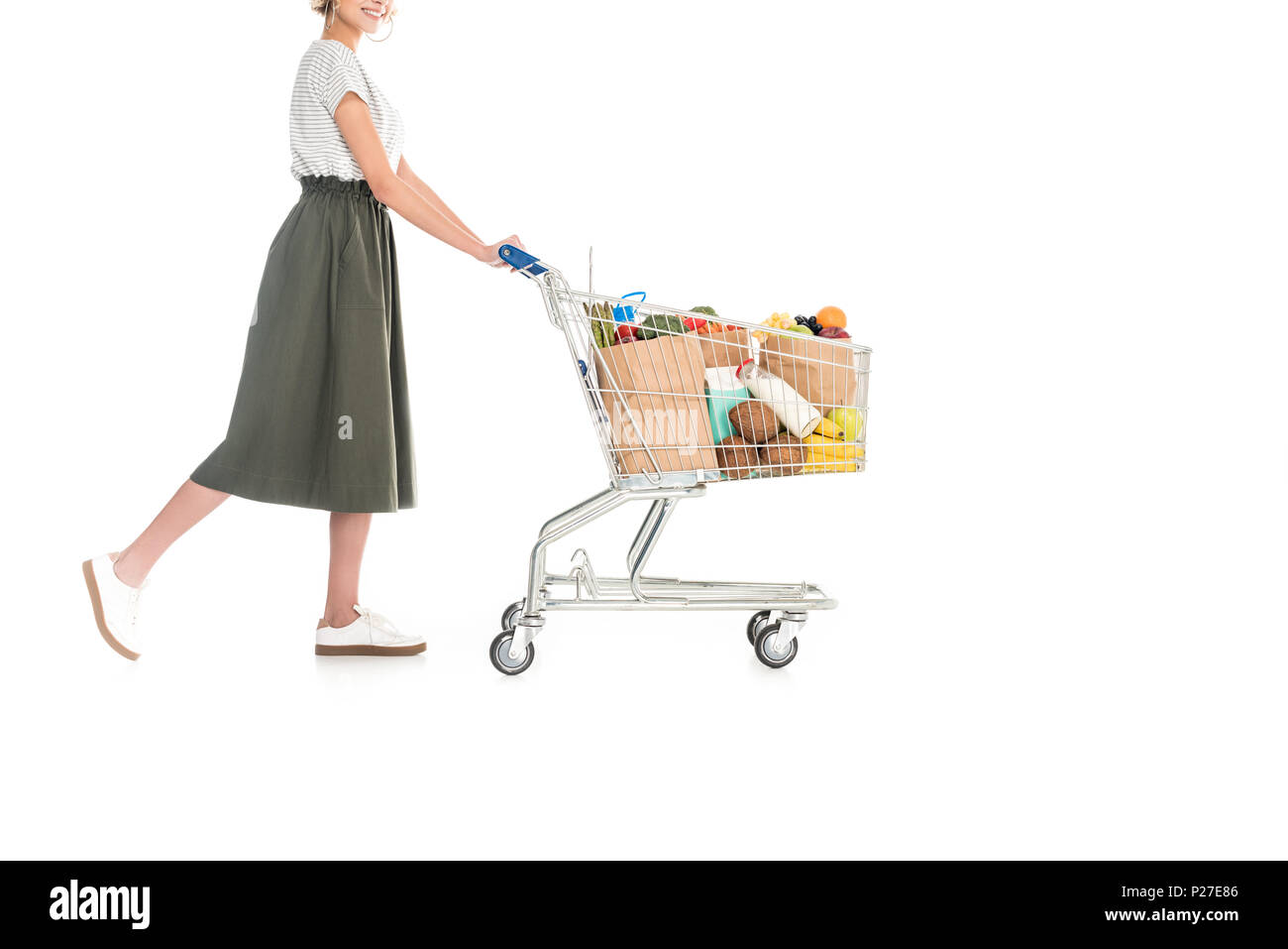 Woman pushing shopping cart side view hi-res stock photography and ...