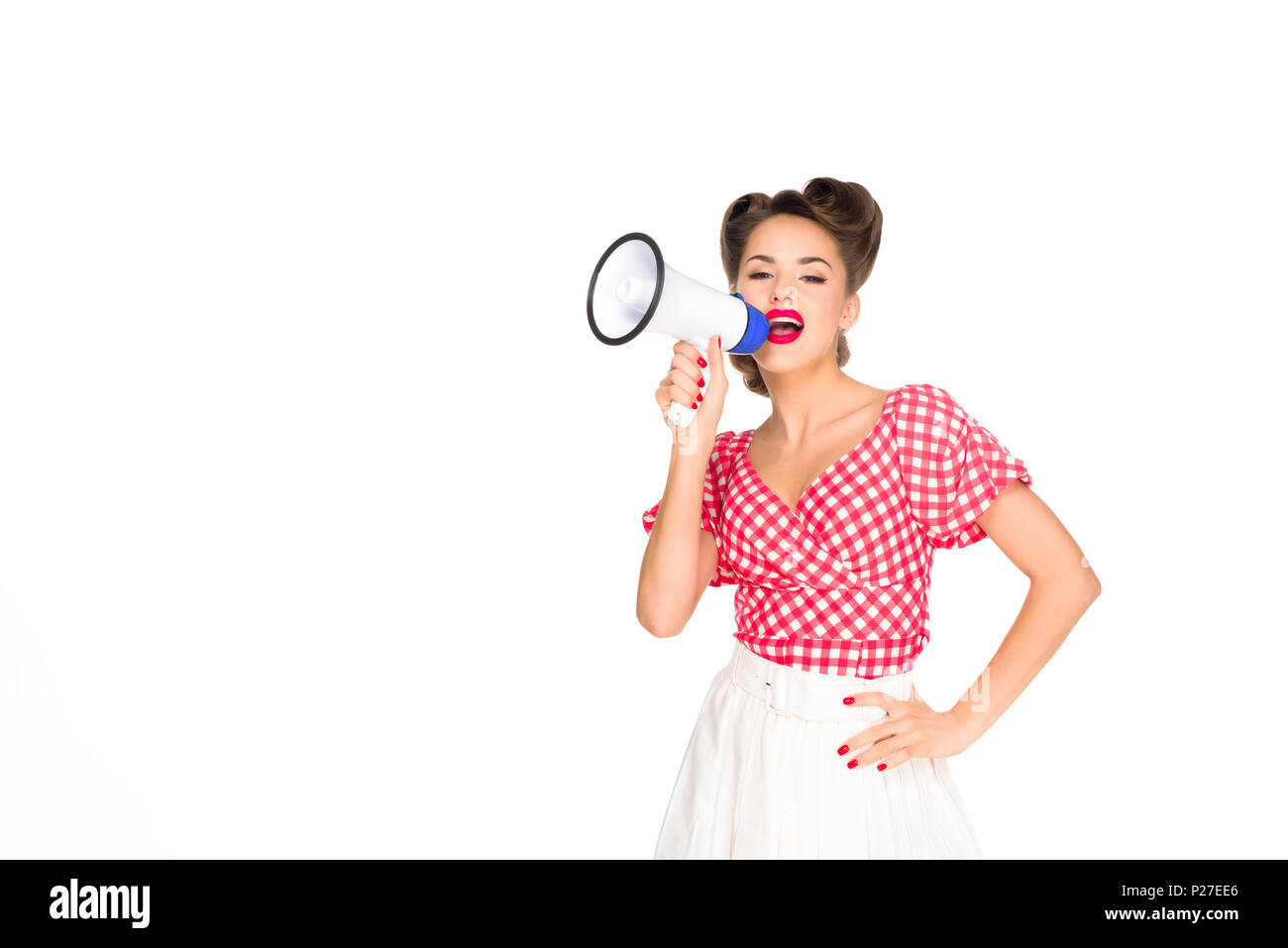 portrait of fashionable young woman in pin up style clothing with ...
