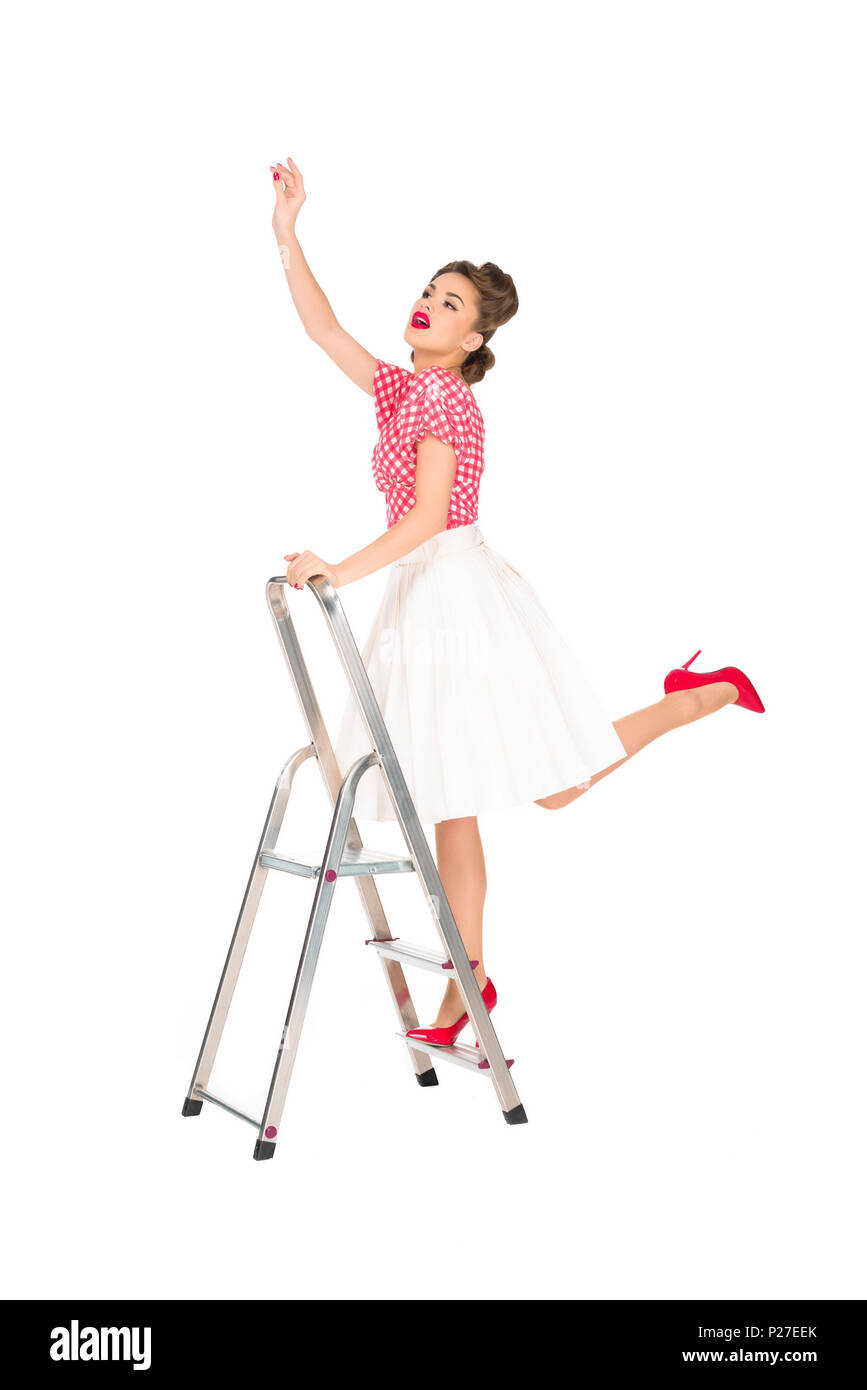 pin up woman standing on ladder isolated on white Stock Photo - Alamy