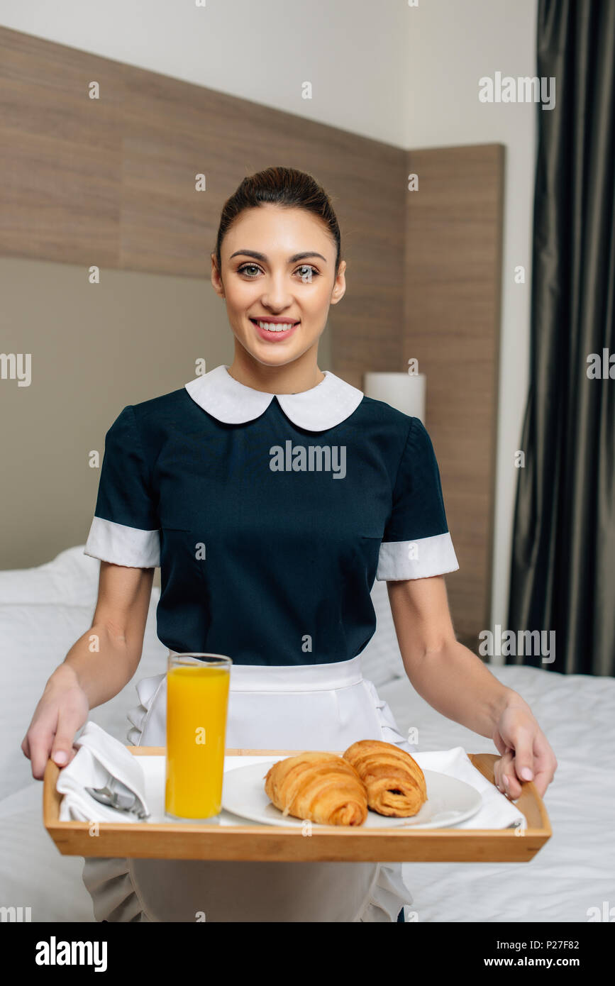 Maid holding breakfast tray in hi-res stock photography and images - Alamy