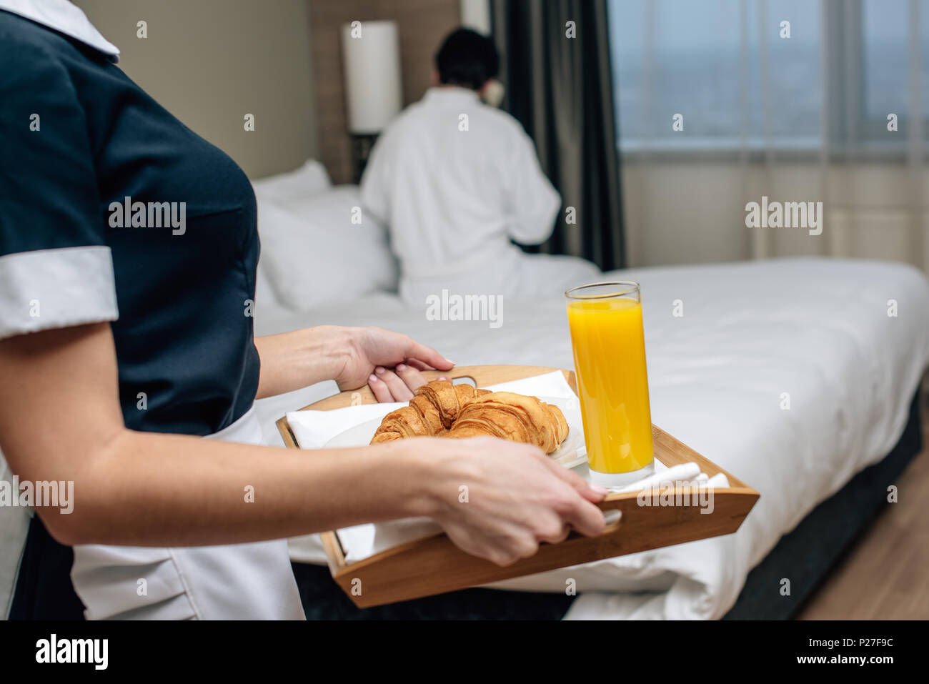 Hotel guest and maid hi-res stock photography and images - Alamy