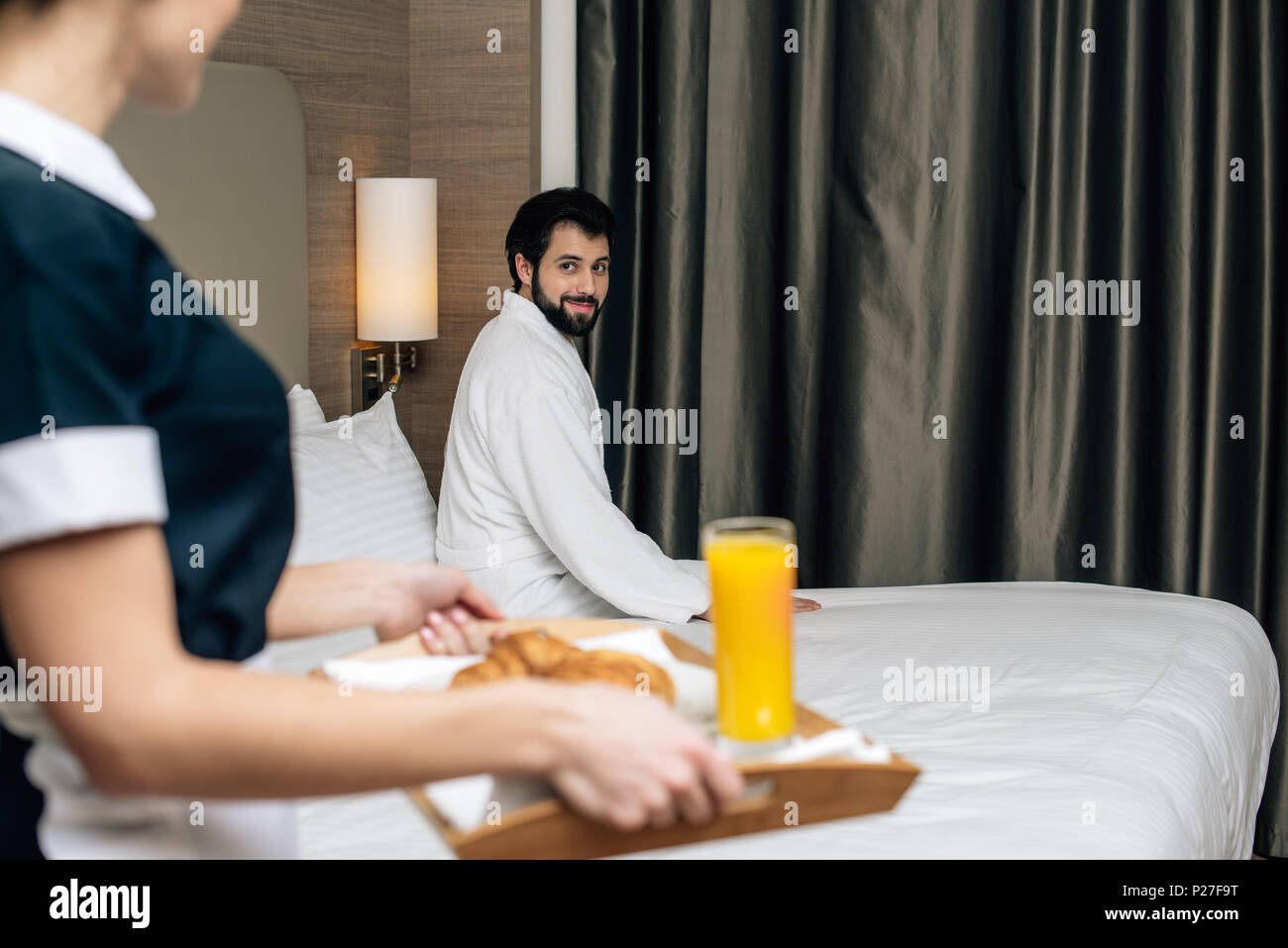 Hotel guest and maid hi-res stock photography and images - Alamy