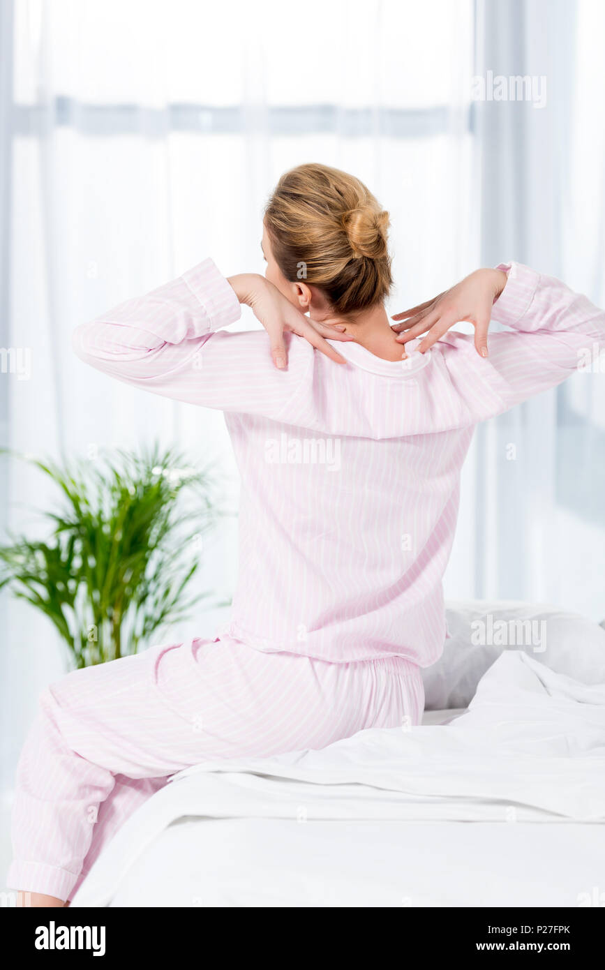 back view of woman stretching after wake up Stock Photo - Alamy