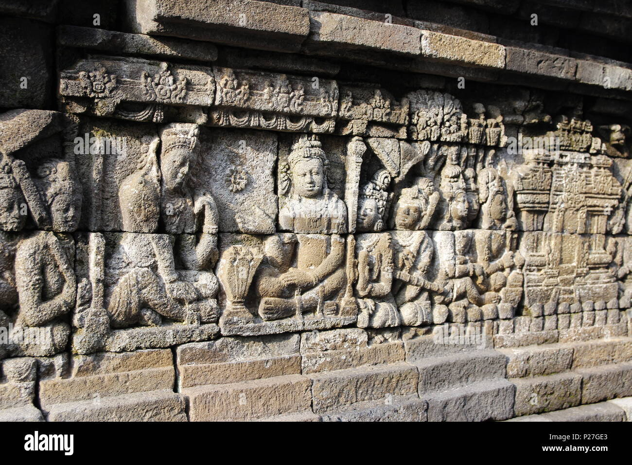 Beautiful bas-relief as wall decor carved in stone at Borobudur Temple ...